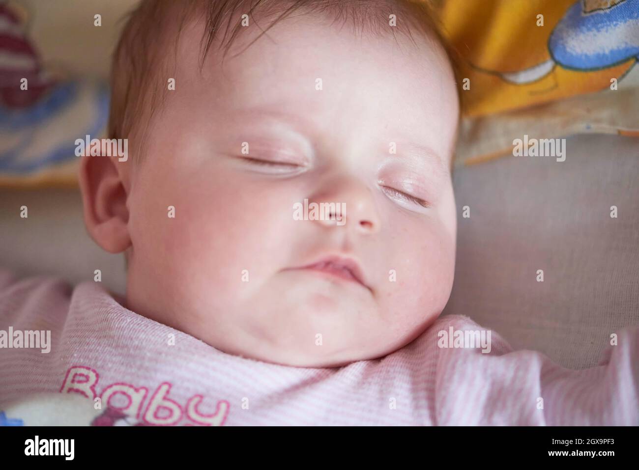 newborn baby girl sleeping in bed at home Stock Photo - Alamy