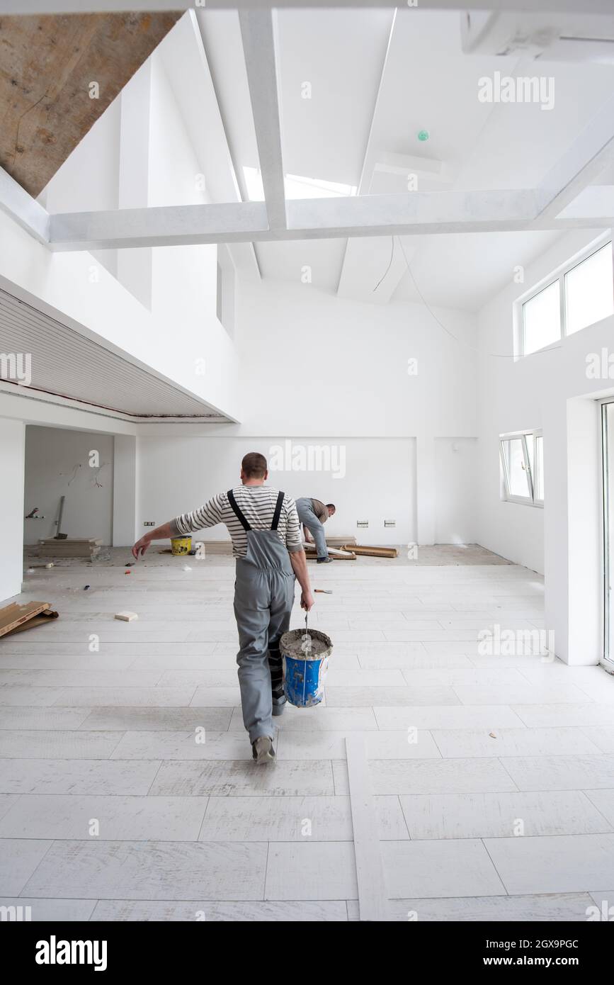 Workers installing new laminated hi-res stock photography and images ...