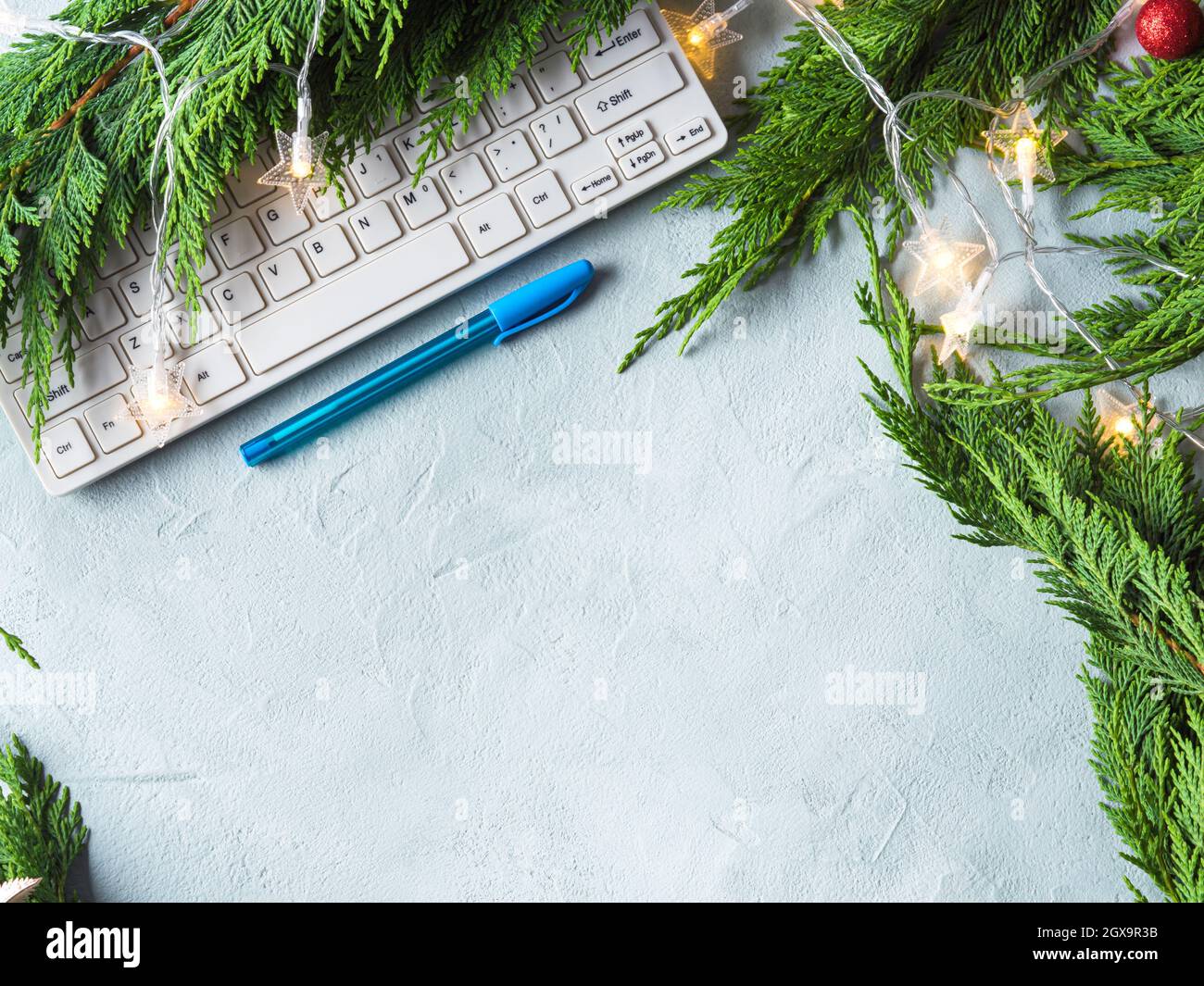 Workplace winter background with keyboard on gray background Stock ...