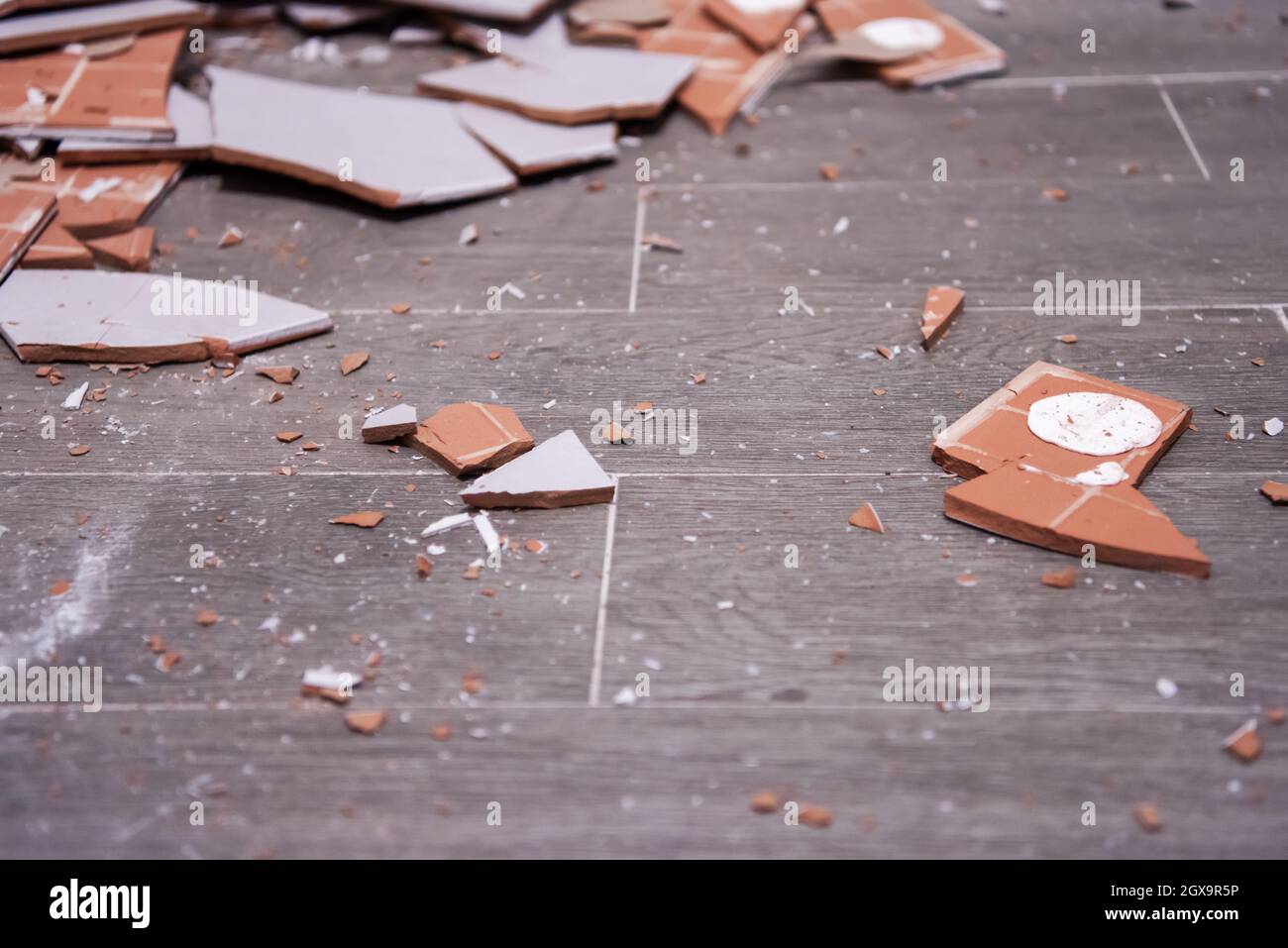 Pile of broken ceramic tiles remains after bathroom renovation prepared ...