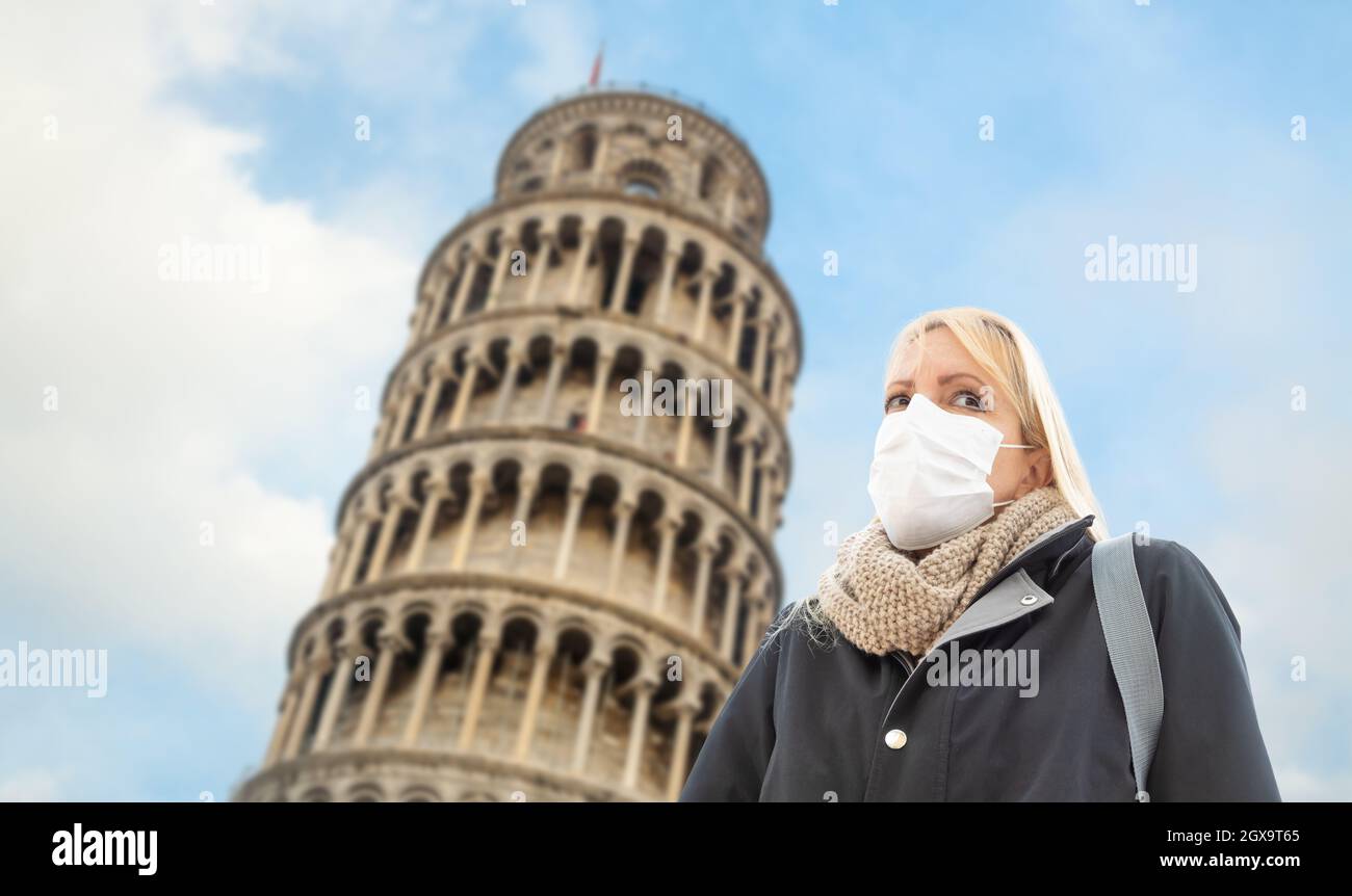 Young Woman Wearing Face Mask Walks Near The Leaning Tower of Pisa In ...