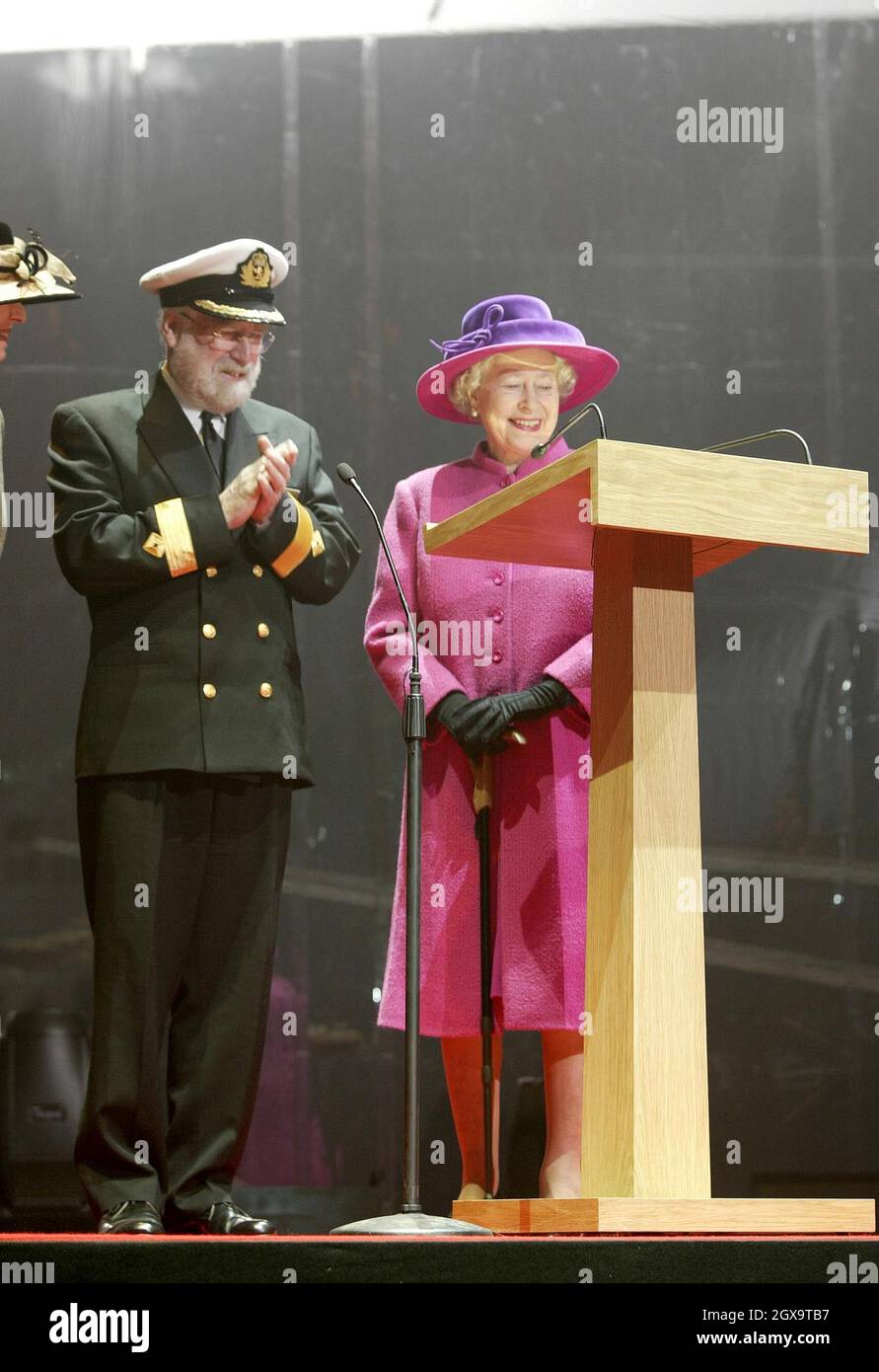 The Queen with Cmdr Ronald Warwick and Cunard President Pamela Conover ...