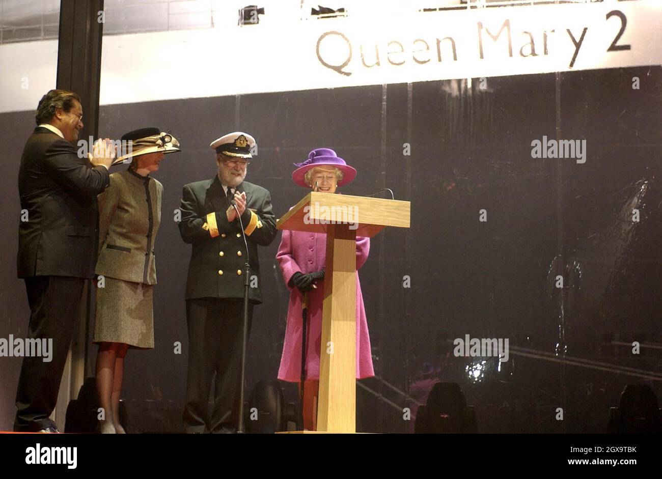 The Queen with Cmdr Ronald Warwick and Cunard President Pamela Conover ...