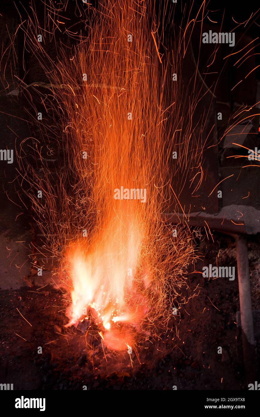 Traditional blacksmith furnace with burning fire Burning fire in ...