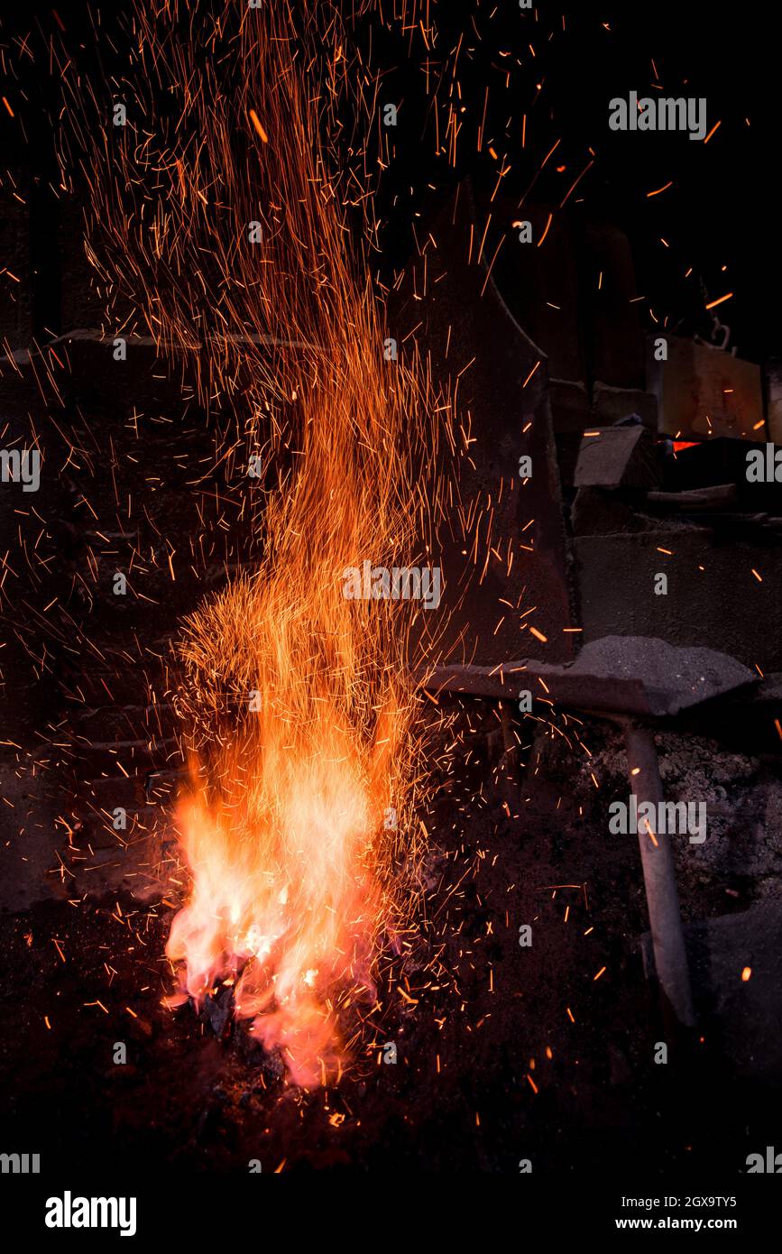 Traditional blacksmith furnace with burning fire Burning fire in ...