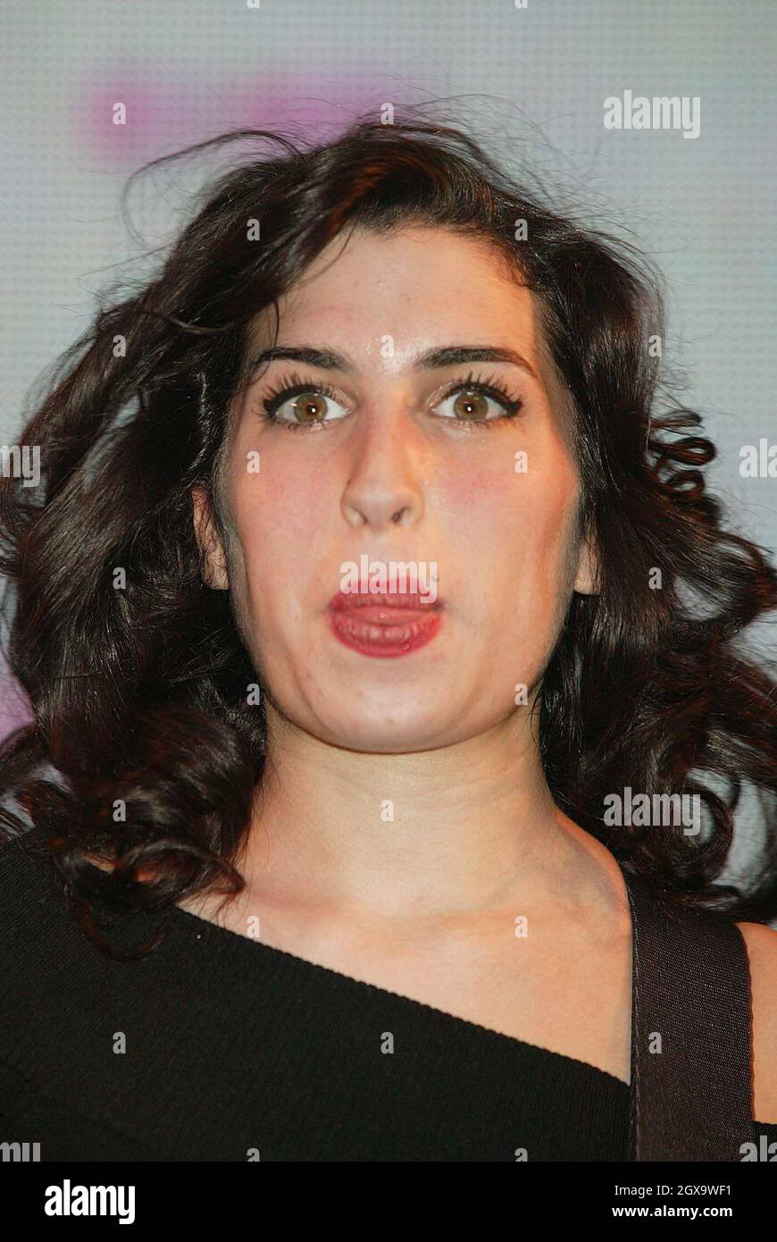 Amy Winehouse performs live on stage at the HMV Store in Oxford Street ...