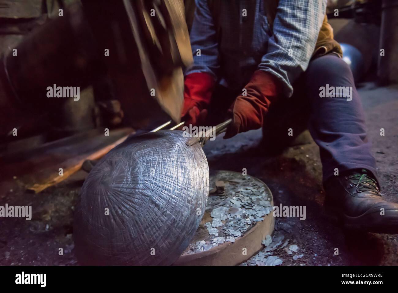 two real brutal traditional blacksmith workers working together with a ...