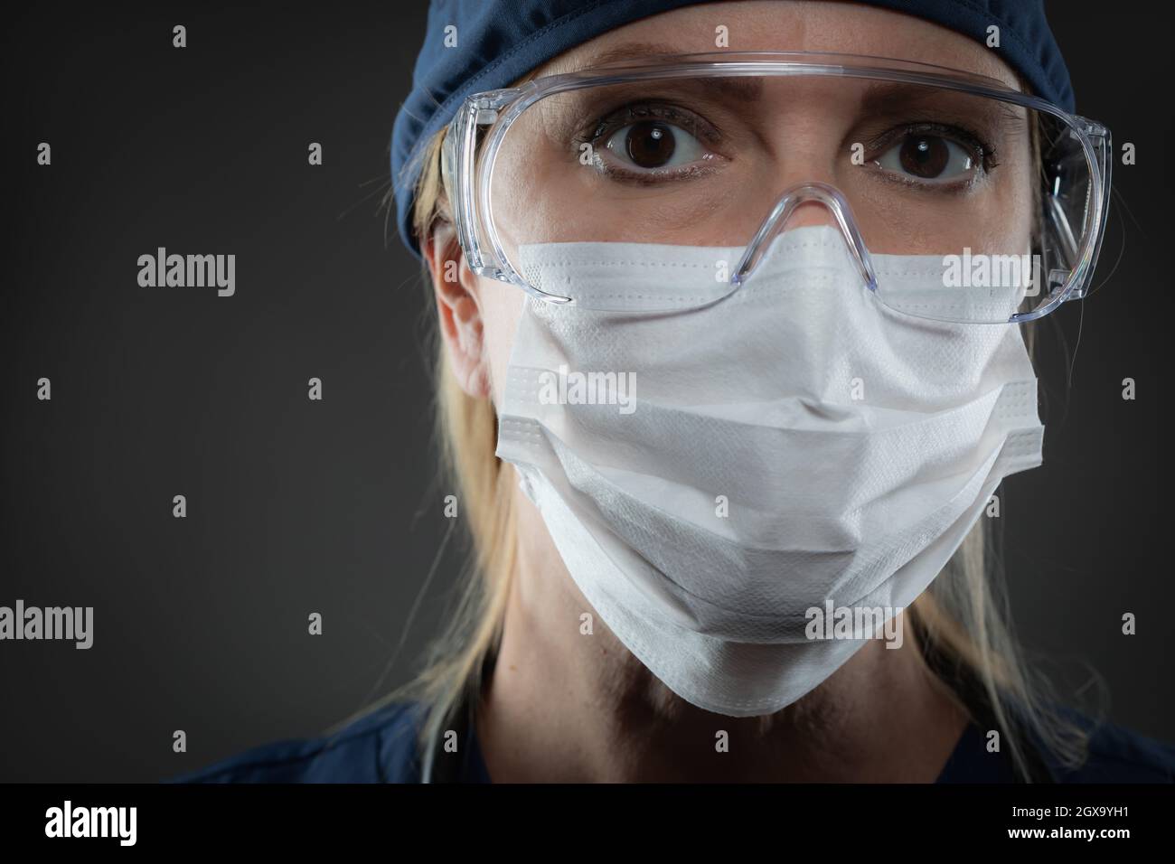 Female Medical Worker Wearing Protective Face Mask and Gear Against ...
