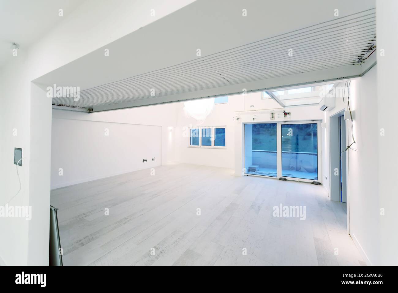 Interior of empty stylish modern open space two level apartment with ...