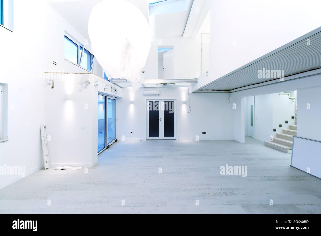 Interior of empty stylish modern open space two level apartment with ...