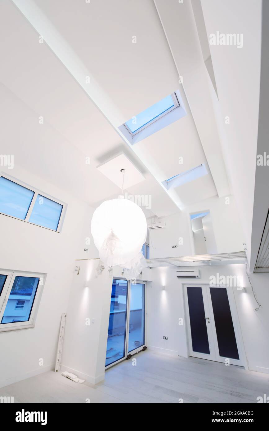Interior of empty stylish modern open space two level apartment with ...