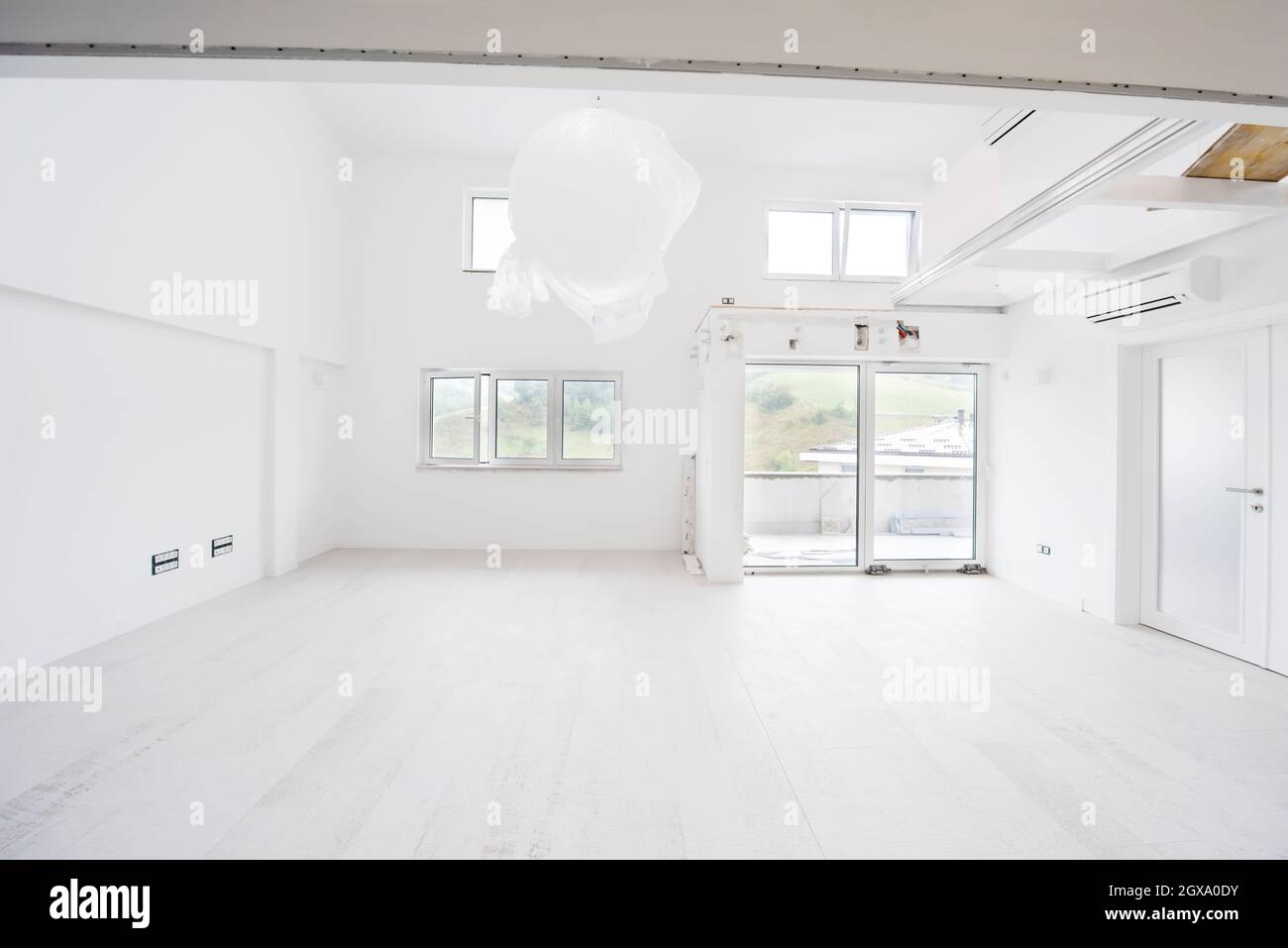 Interior of empty stylish modern open space two level apartment with ...