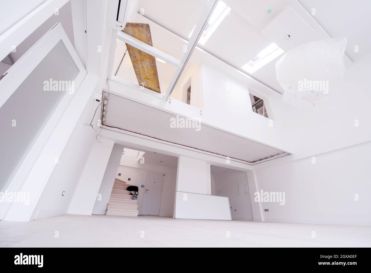 Interior of empty stylish modern open space two level apartment with ...