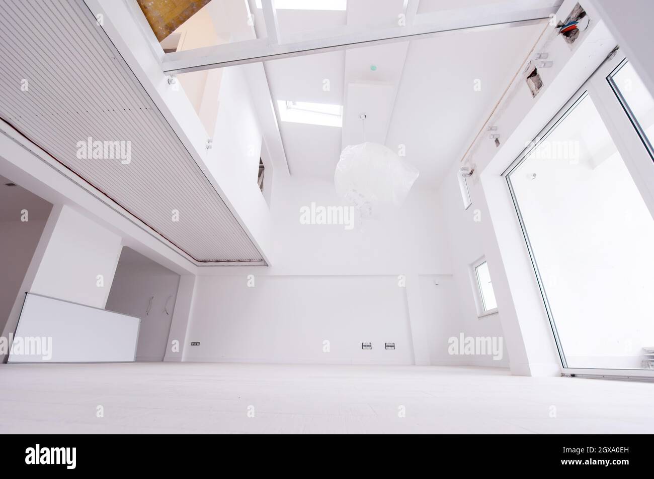 Interior of empty stylish modern open space two level apartment with ...