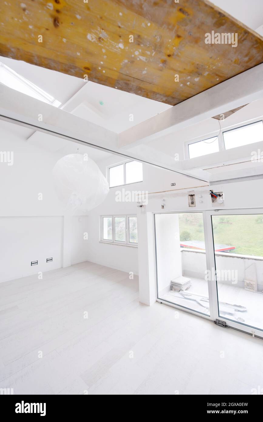 Interior of empty stylish modern open space two level apartment with ...