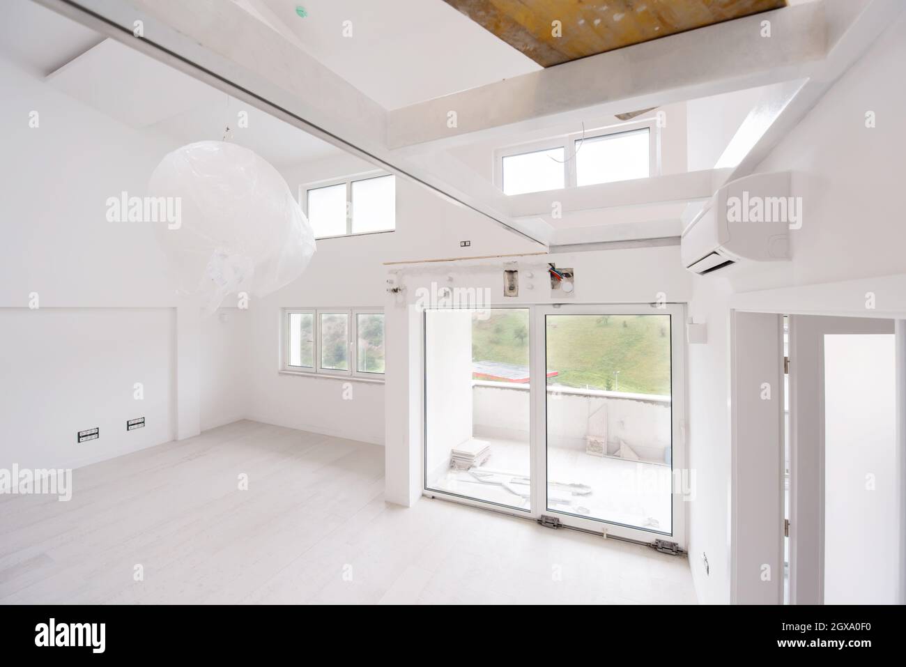 Interior of empty stylish modern open space two level apartment with ...