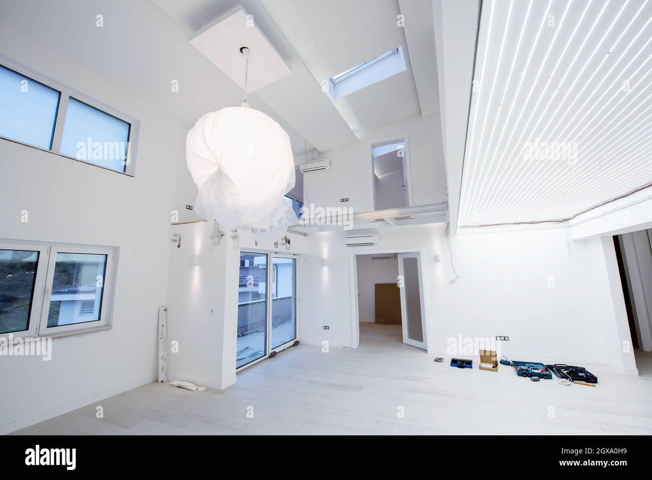 Interior of empty stylish modern open space two level apartment with ...