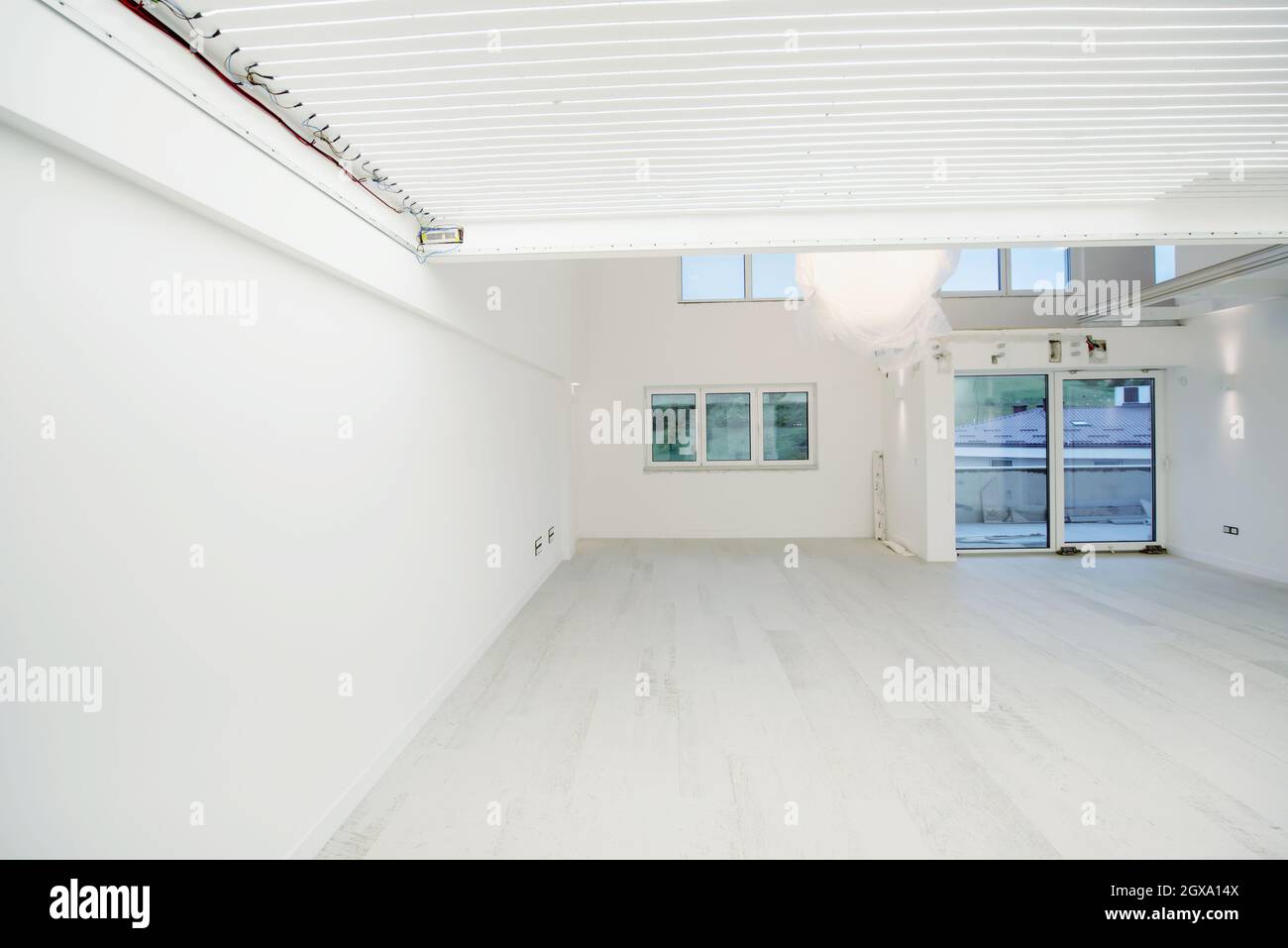 Interior of empty stylish modern open space two level apartment with ...