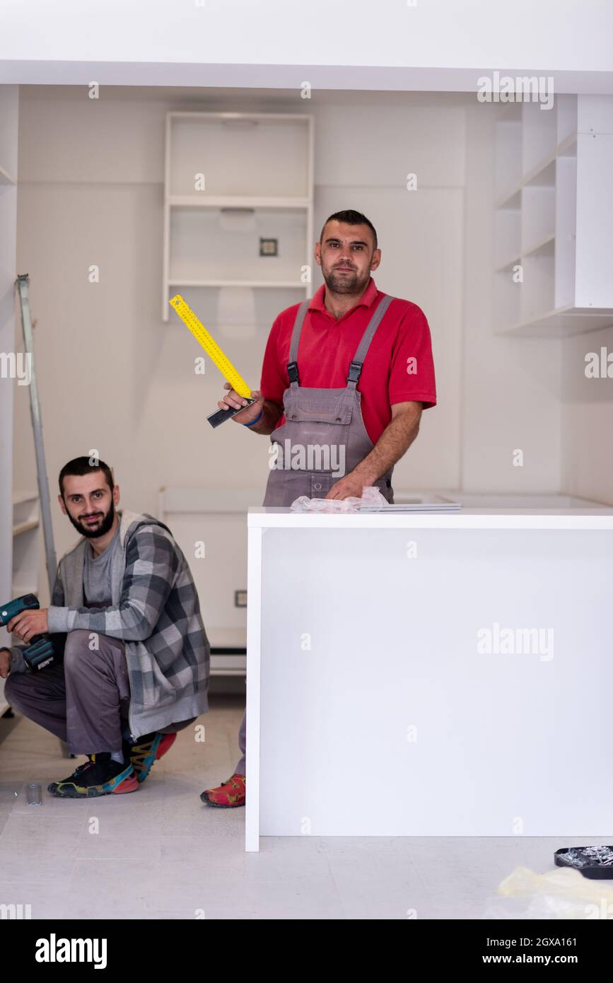 portrait of two professional workers during installation a new stylish ...