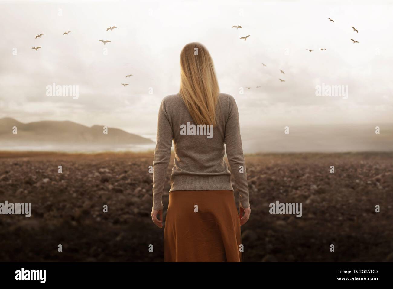 Woman walking towards the light hi-res stock photography and images - Alamy