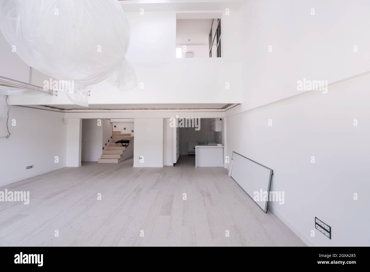 Interior of empty stylish modern open space two level apartment with ...