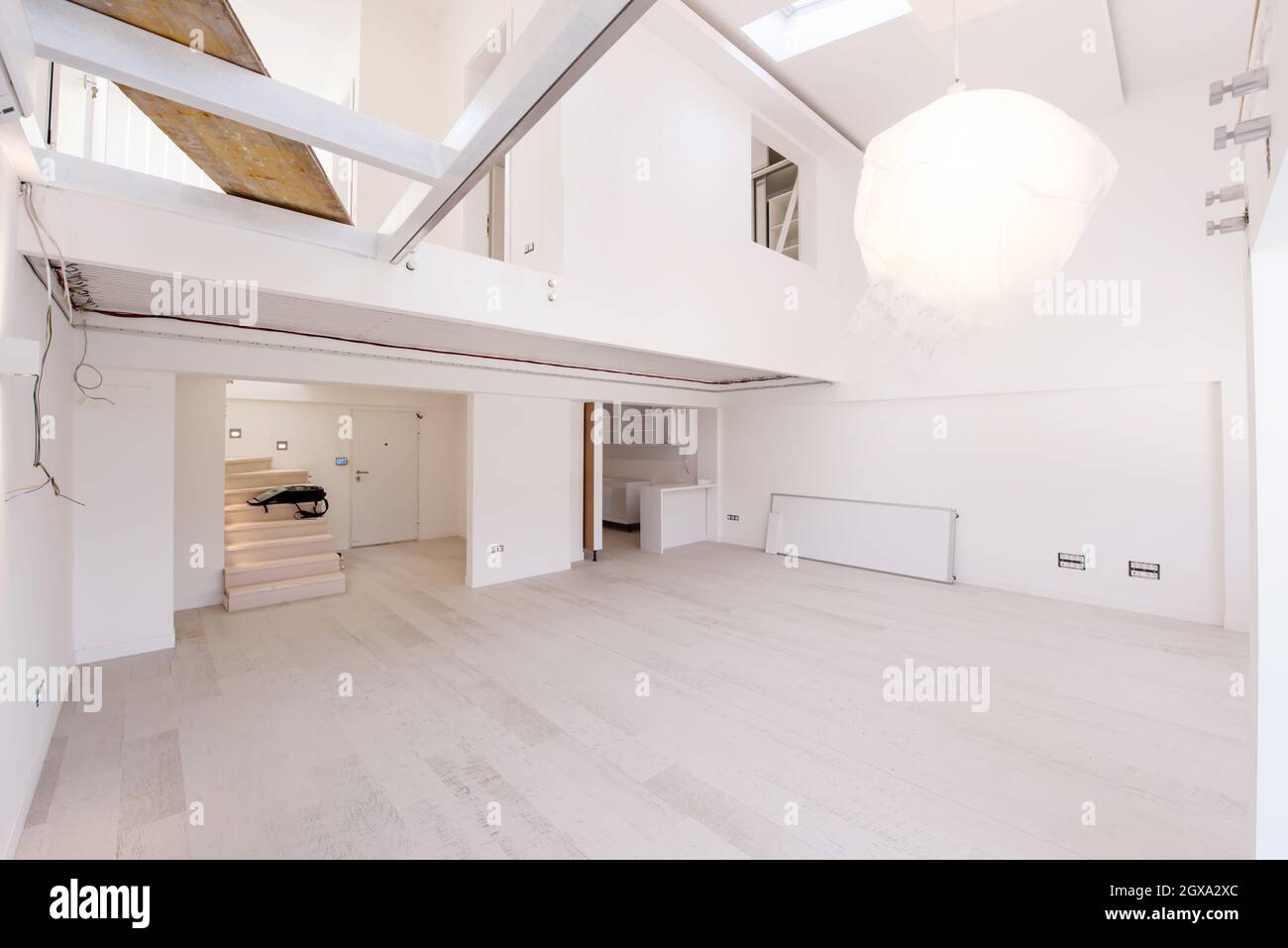 Interior of empty stylish modern open space two level apartment with ...