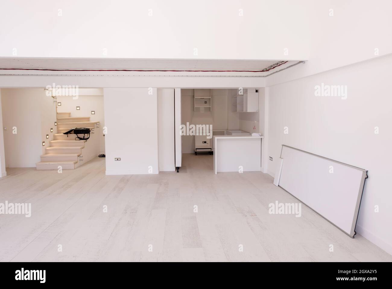 Interior of empty stylish modern open space two level apartment with ...