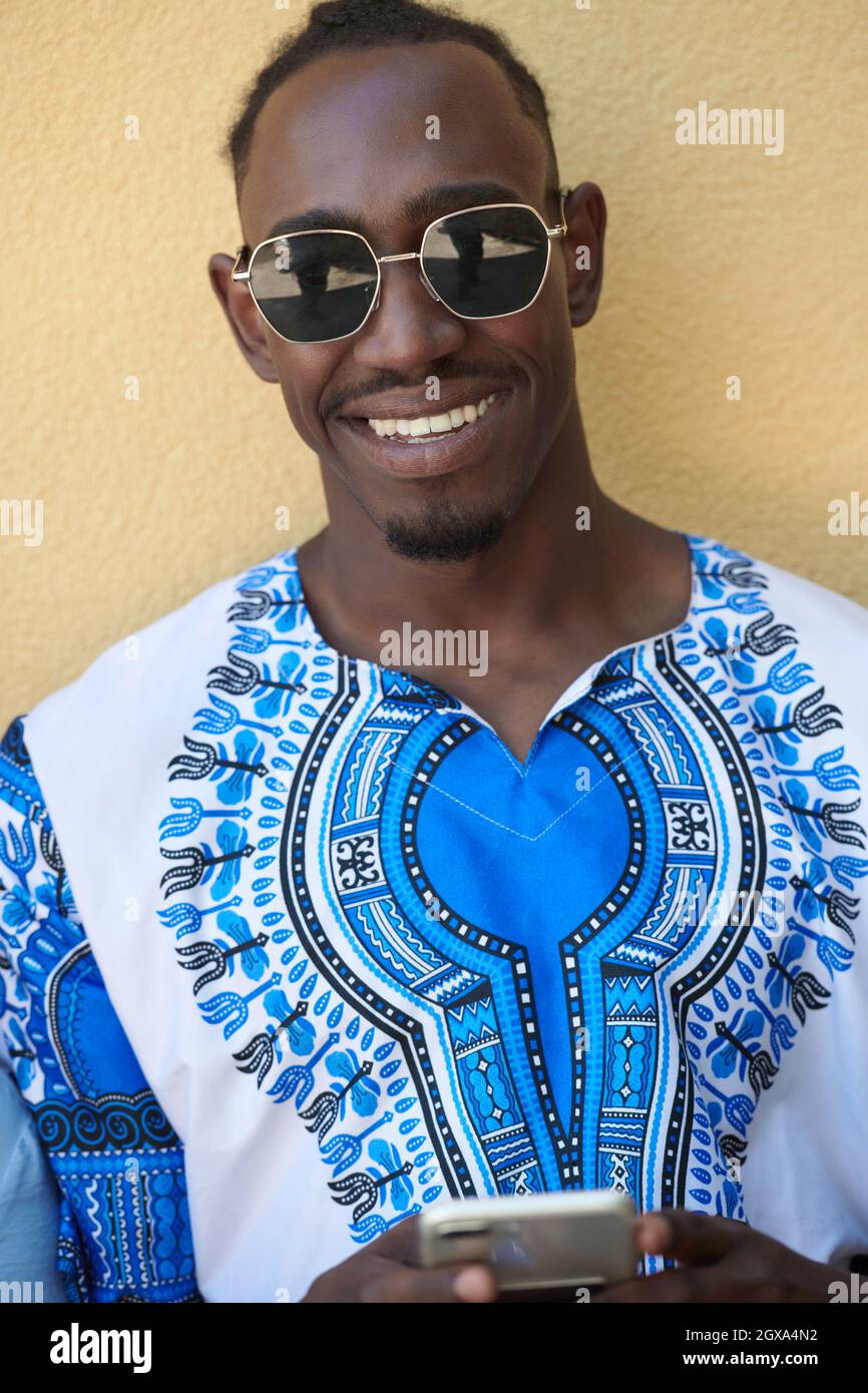 Native Sudan black african man using smart phone and wearing ...