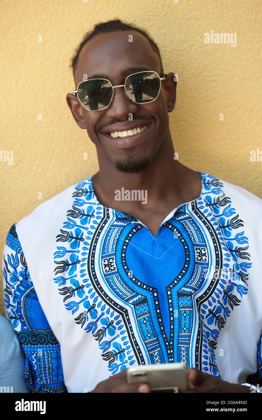 Native Sudan black african man using smart phone and wearing ...