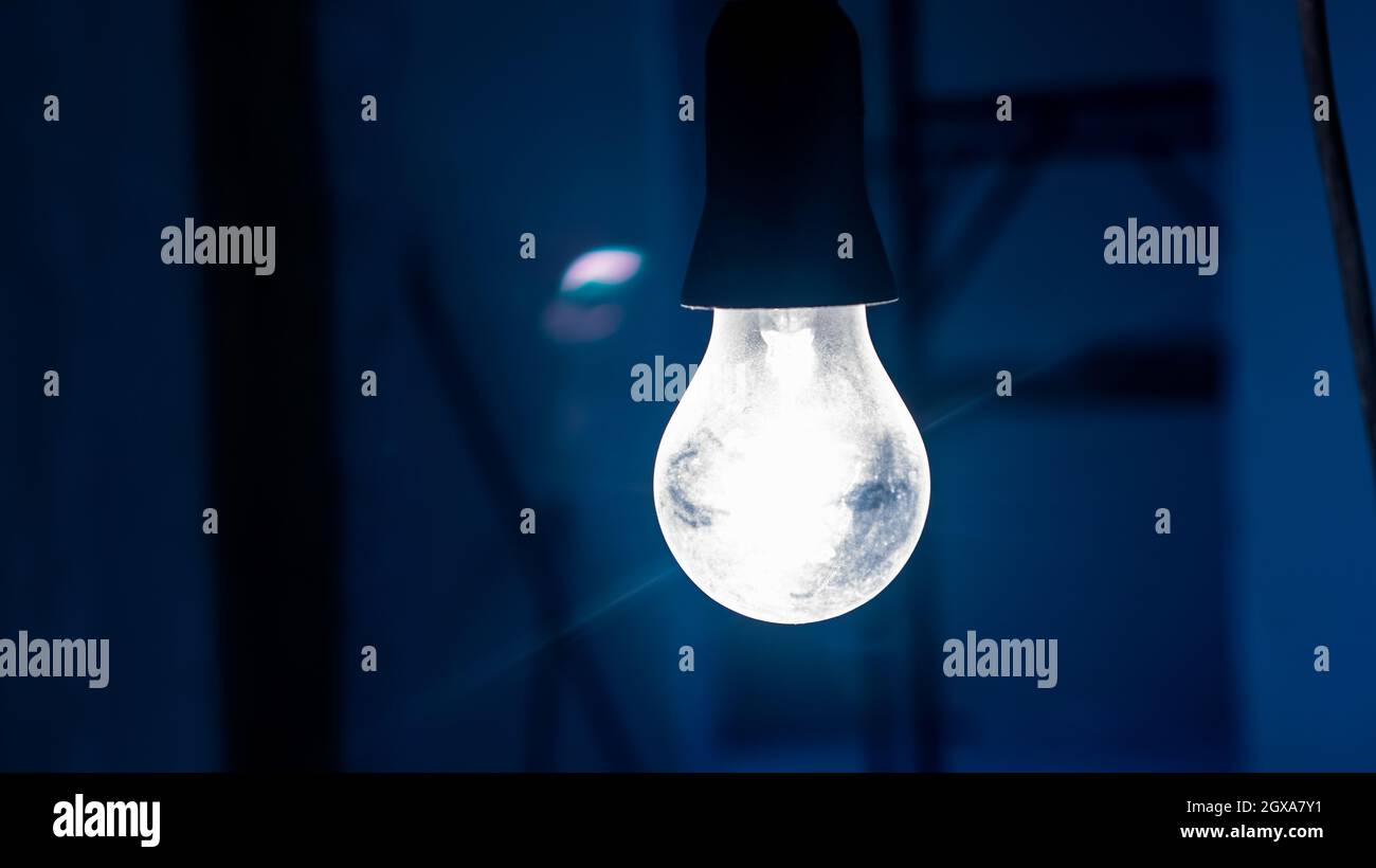 Electric lighting bulb on the dark background Stock Photo - Alamy