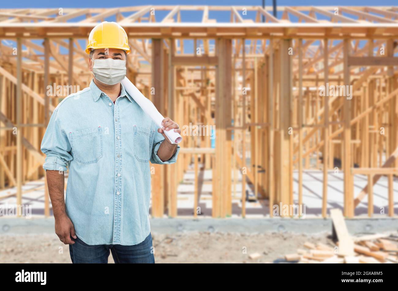 Male Contractor In Hard Hat Wearing Medical Face Mask During ...