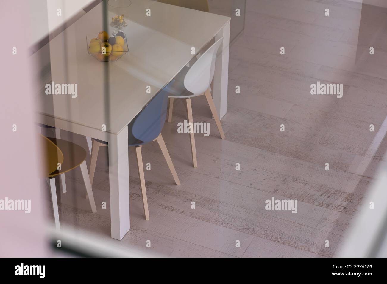outside view trough window dining table in luxury interior of stylish ...