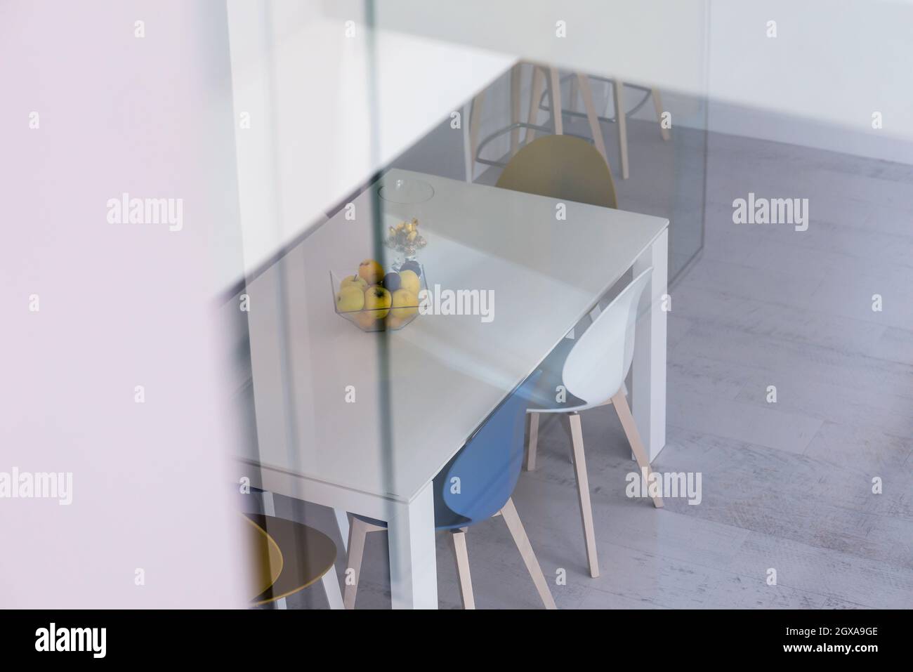 outside view trough window dining table in luxury interior of stylish ...