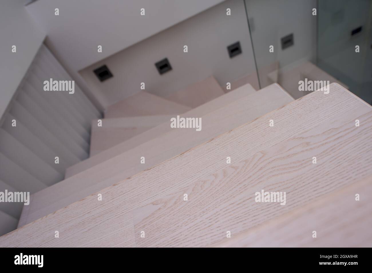 stylish interior with wooden stairs in big modern two level luxury ...