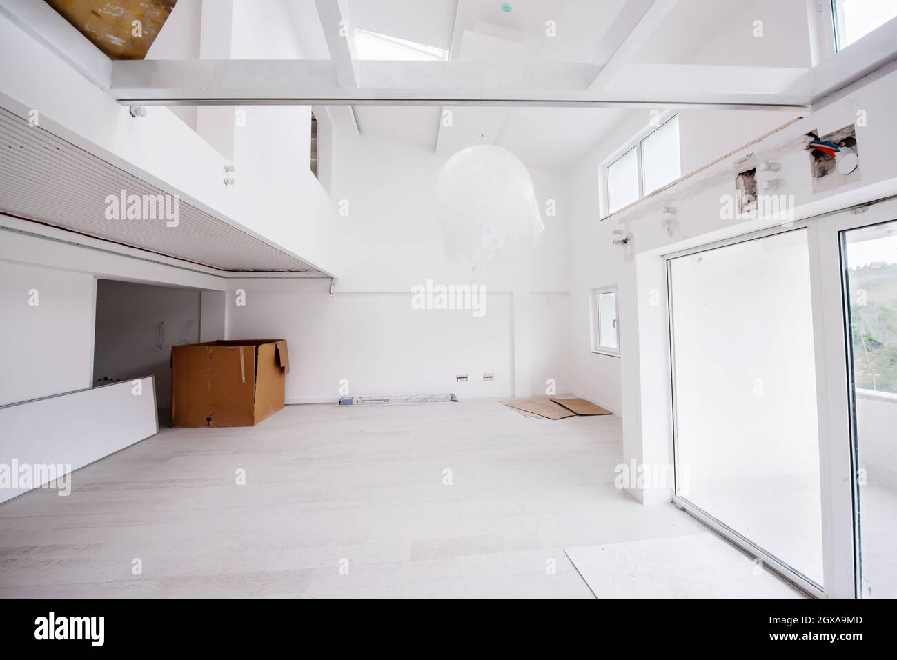 Interior of empty stylish modern open space two level apartment with ...