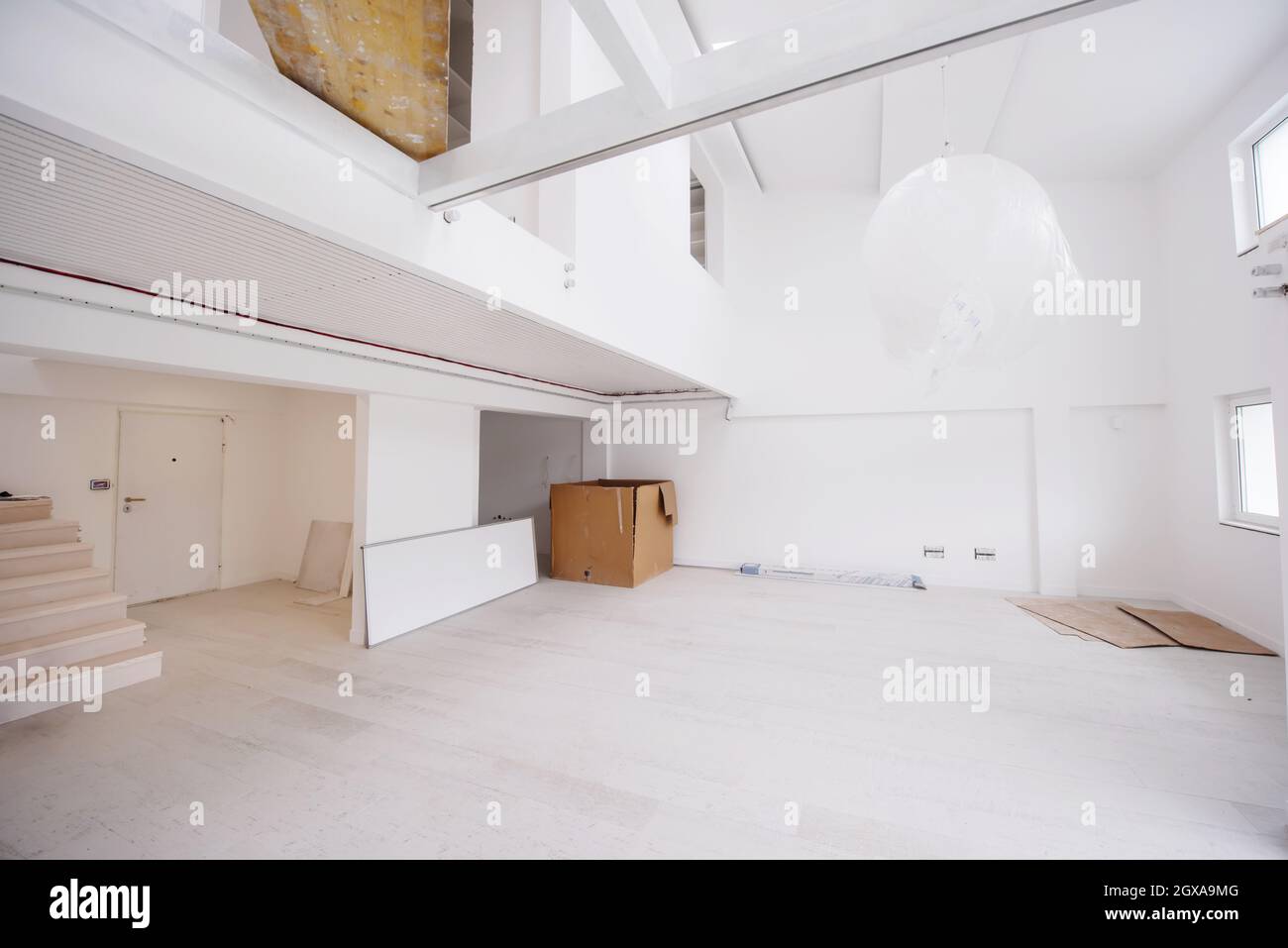 Interior of empty stylish modern open space two level apartment with ...