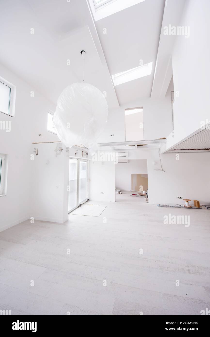 Interior of empty stylish modern open space two level apartment with ...