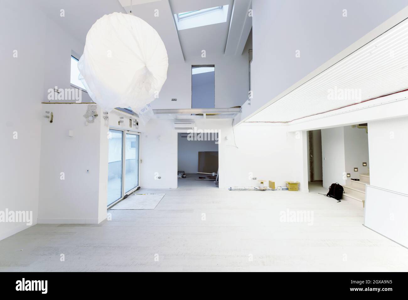 Interior of empty stylish modern open space two level apartment with ...