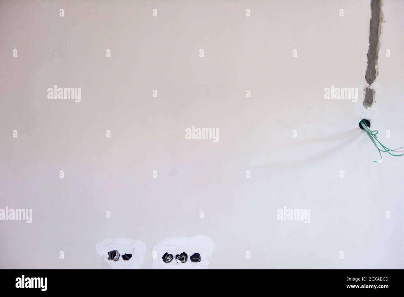 Socket back boxes with wires in a wall. Cabling background. electrical ...