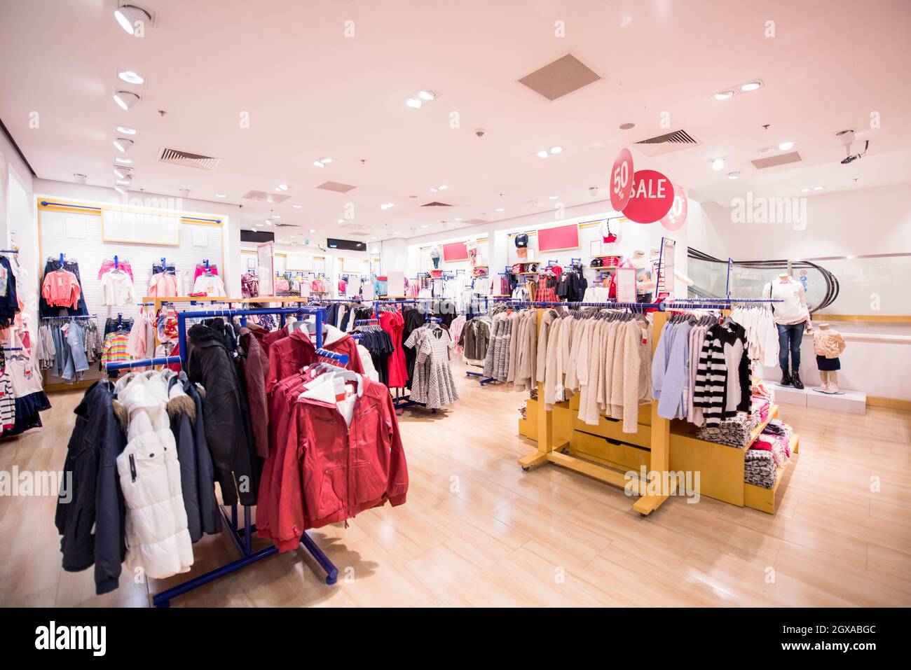 luxury and fashionable brand new interior of clothing store Stock Photo ...