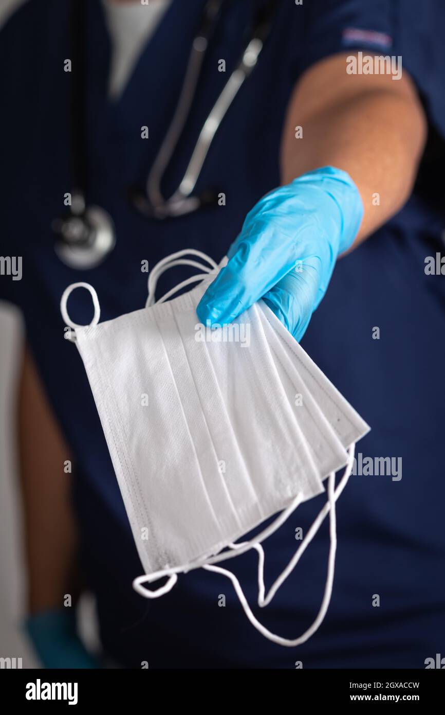 Female Doctor or Nurse Wearing Surgical Gloves Holding A Few Medical ...