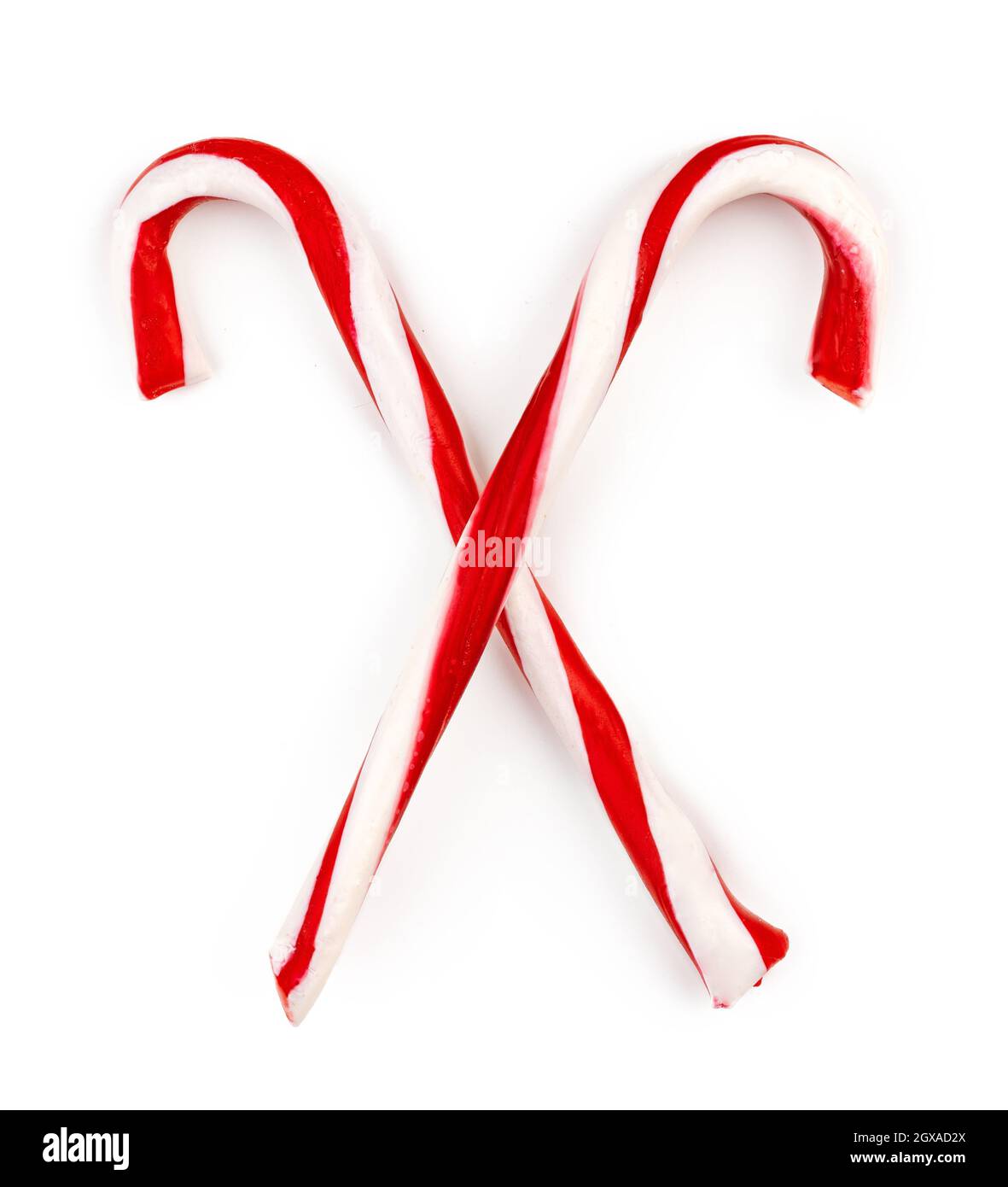 Two candy canes isolated on white background Stock Photo - Alamy