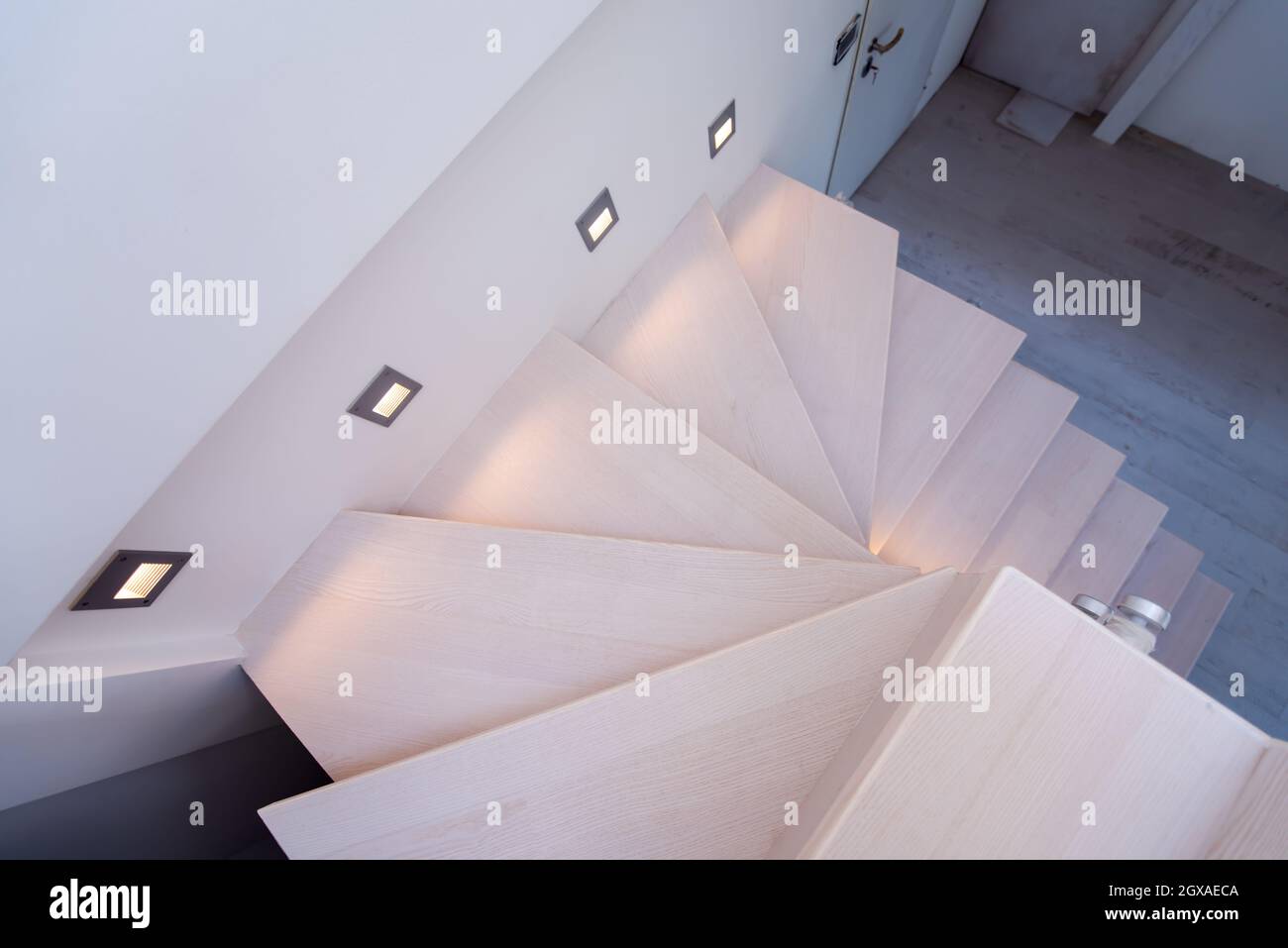 stylish interior with wooden stairs in big modern two level luxury ...