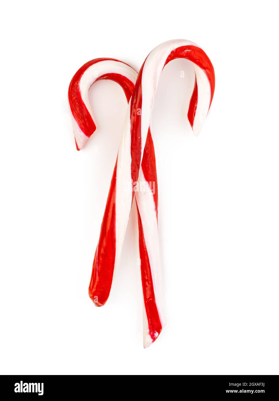Two candy canes isolated on white background Stock Photo - Alamy