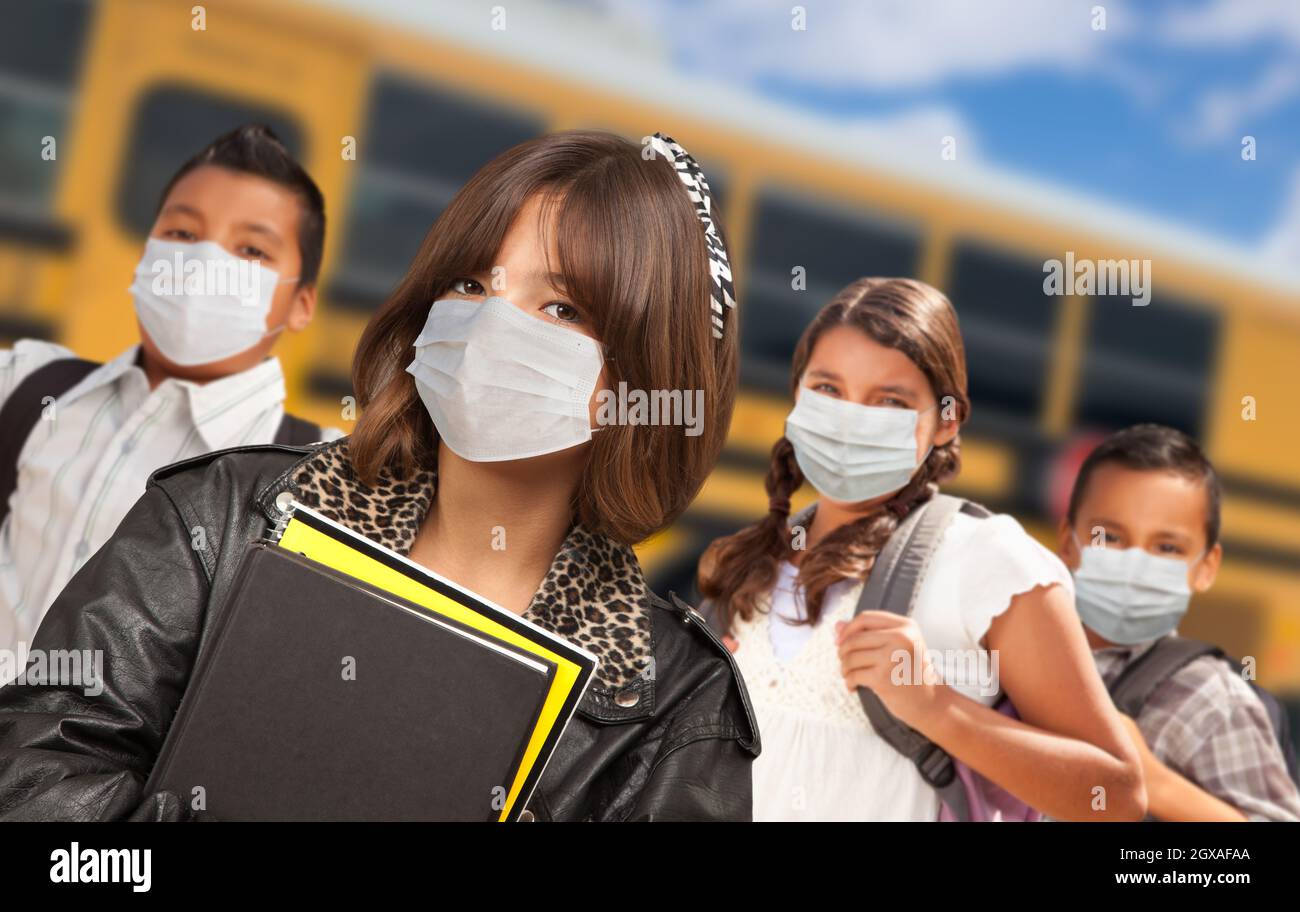 Hispanic Students Near School Bus Wearing Medical Face Face Masks Stock ...