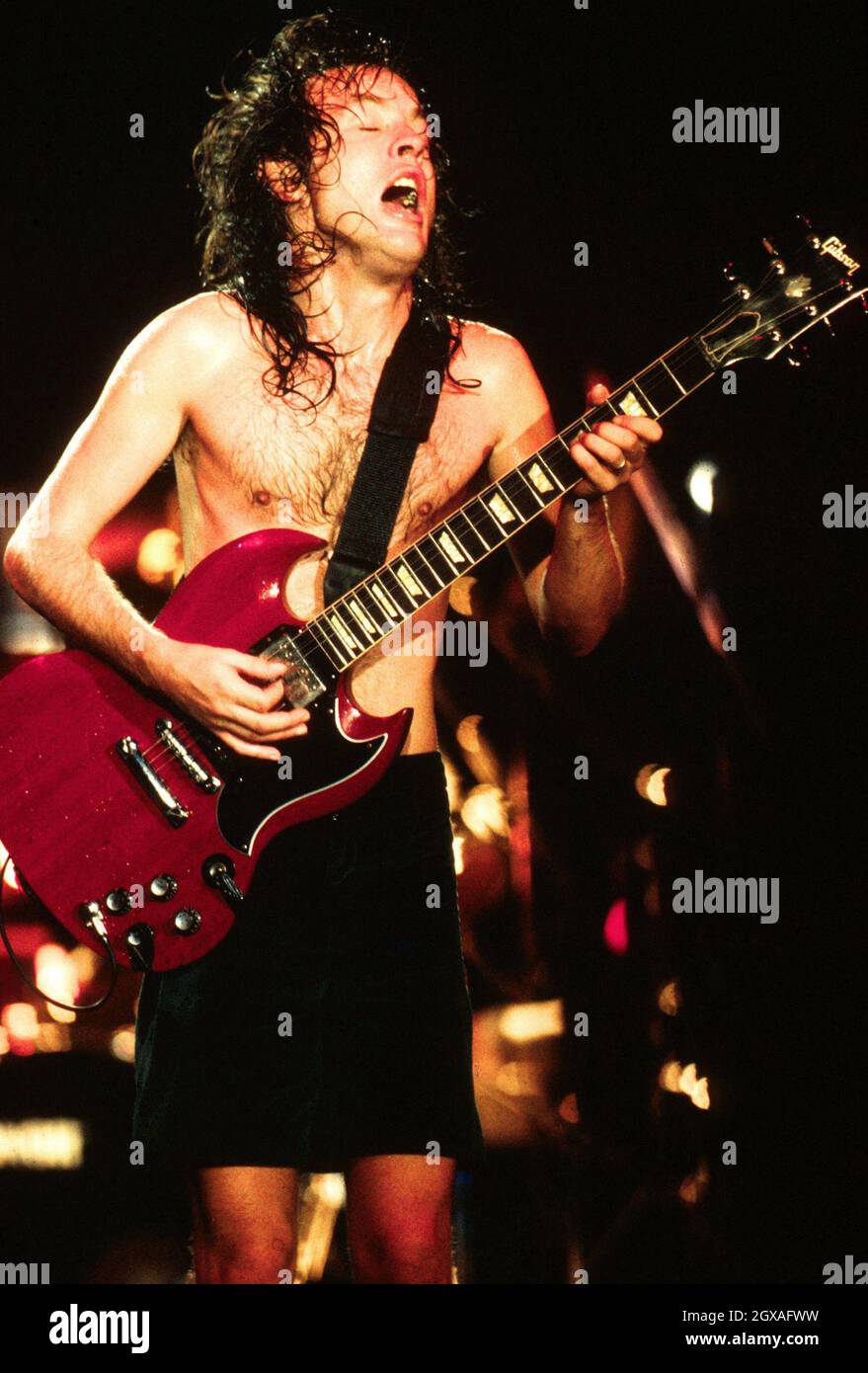 Angus Young of AC DC performing live in concert Stock Photo - Alamy