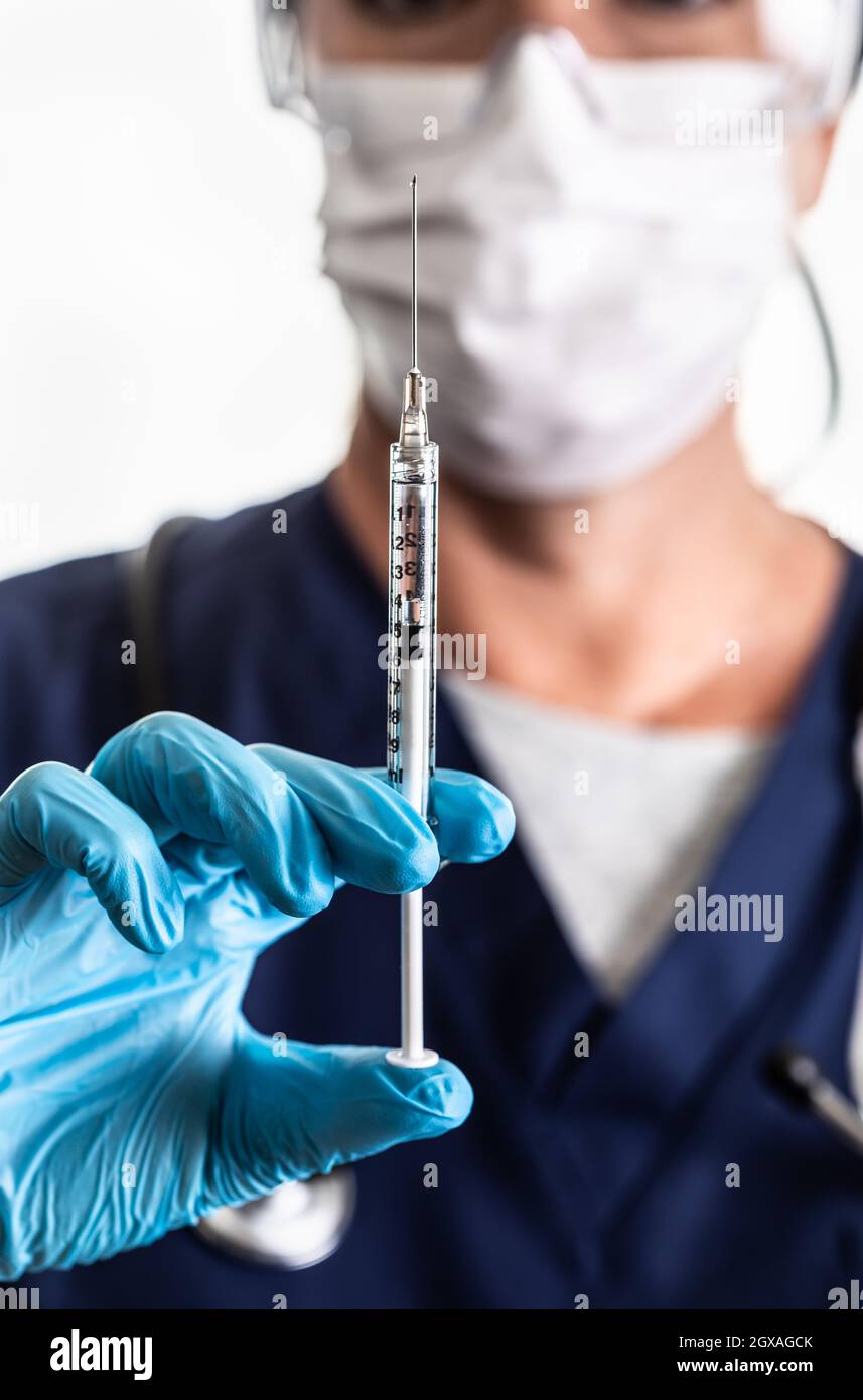 Doctor or Nurse Holding Medical Syringe with Needle Stock Photo - Alamy