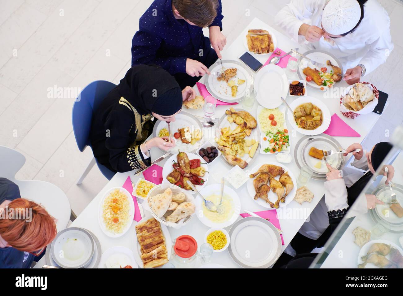 Eid Mubarak Muslim family having Iftar dinner Eating traditional food ...