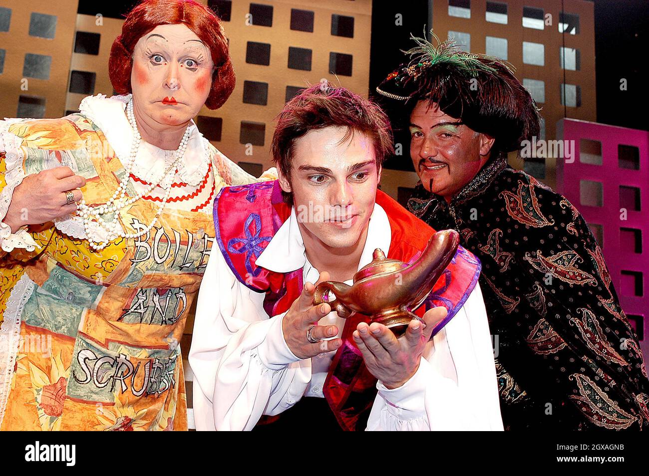 Tudor Davies as Widow Twankey, Karl Howman as Abanazar and Jay Bunyan ...