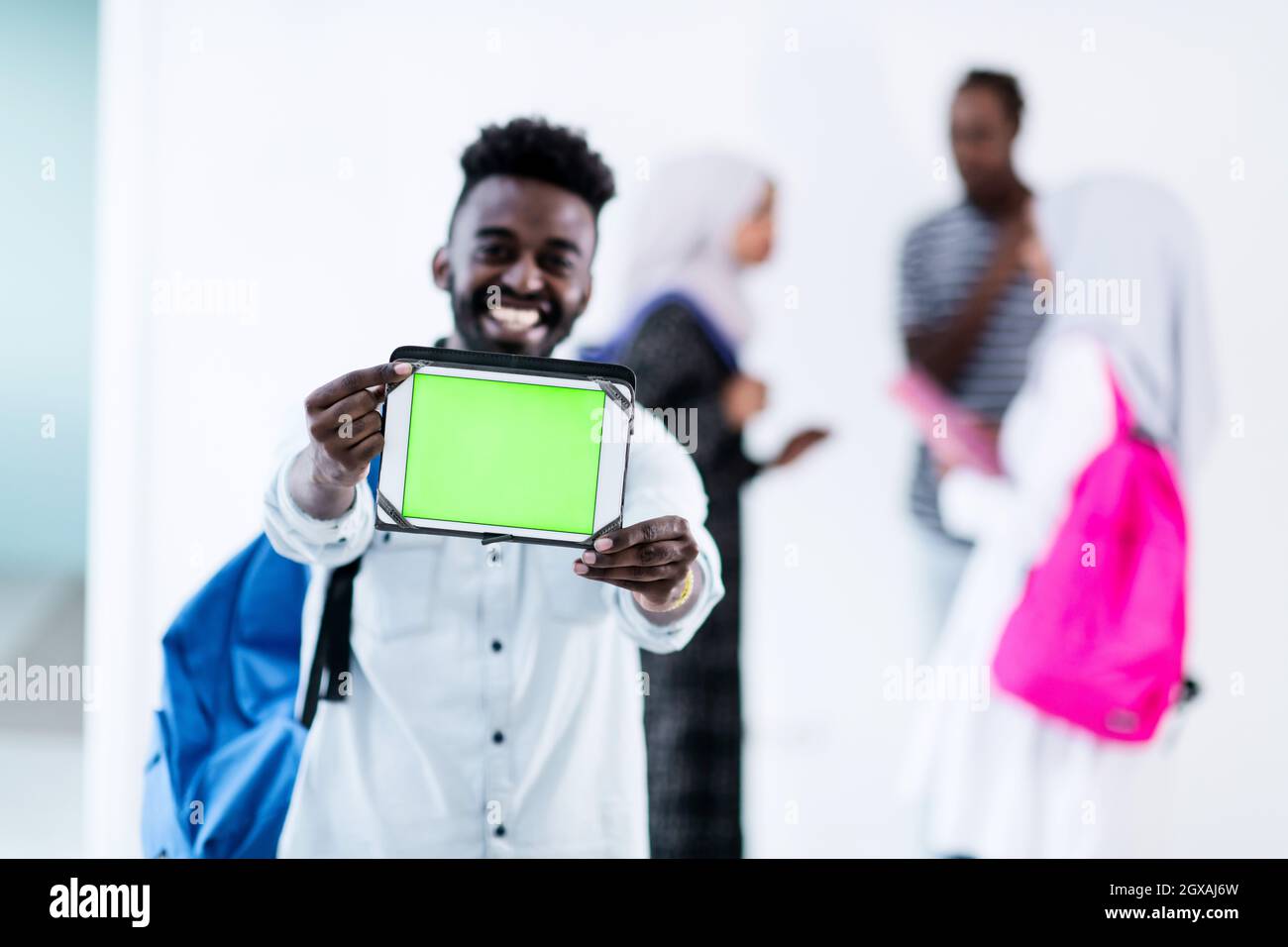 university lifestyle handsome young african student man holding tablet ...